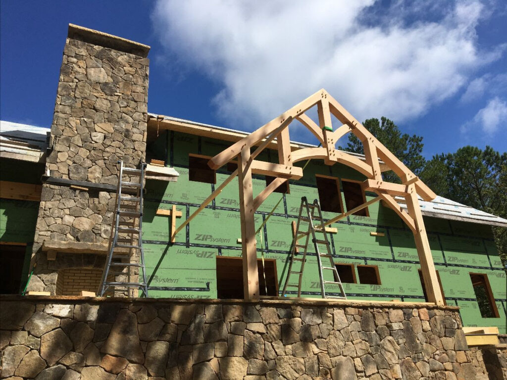 Timber frame trusses create an open and dramatic effect