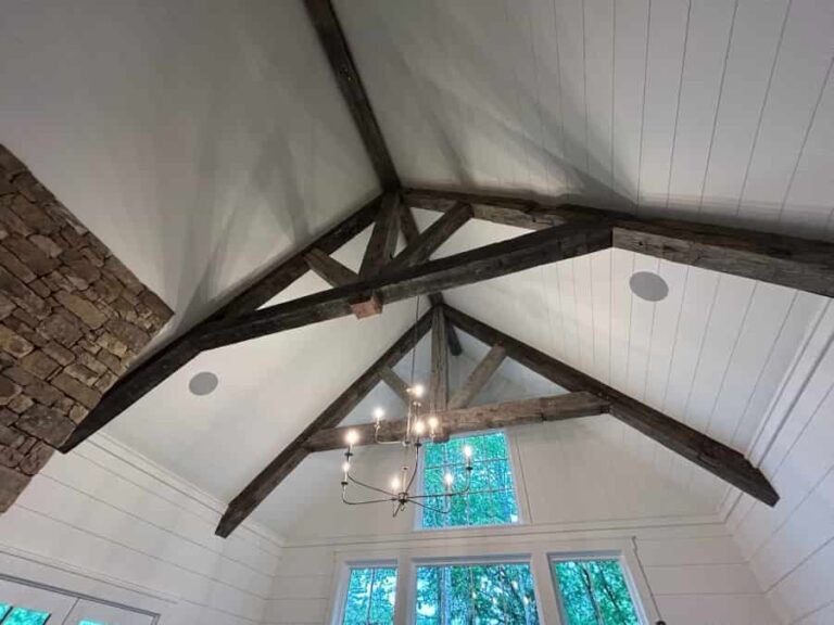 Timber frame trusses create an open and dramatic effect